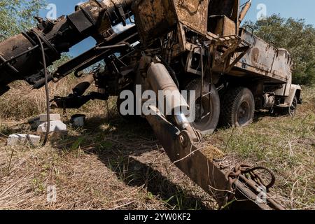 Abandoned Heavy Machinery in Overgrown Terrain Stock Photo - Alamy