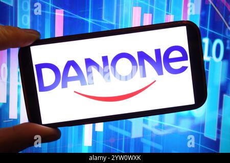 In this photo illustration, the Danone company logo is seen displayed ...