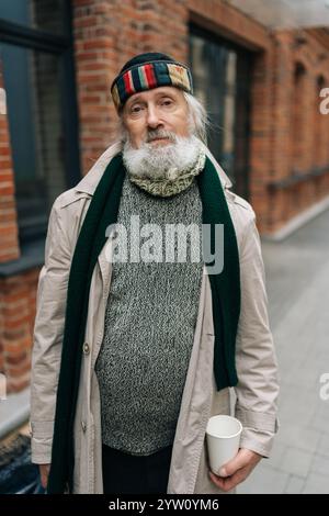 A portrait of a bearded tramp wearing a hat, captured in a half-length ...