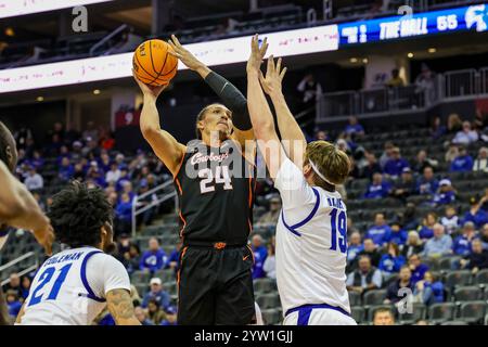 Oklahoma State forward Patrick Suemnick (24) guards Houston guard Milos ...