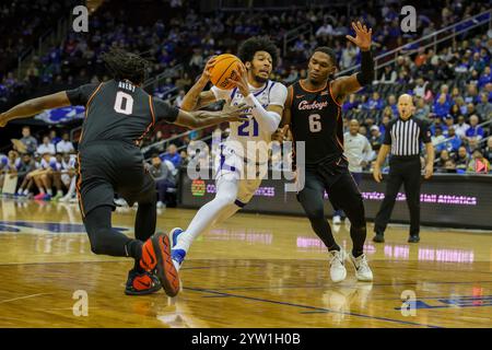 Oklahoma State forward Marchelus Avery (0) shoots under pressure from ...