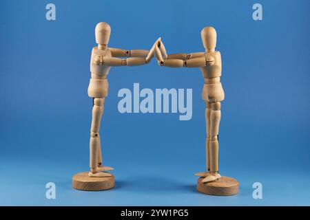 Wooden figure representing various dance movements demonstrating joy ...
