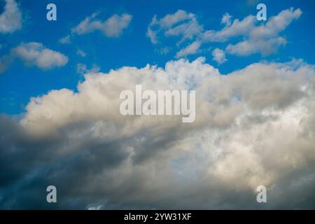 The cumulus clouds were scattered across the blue sky, adding to the ...