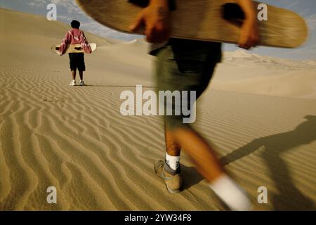 Two local sandboarders in the Ica Desert, Peru Stock Photo - Alamy