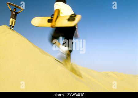 Two local sandboarders in the Ica Desert, Peru Stock Photo - Alamy