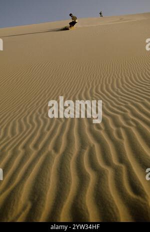 Two local sandboarders in the Ica Desert, Peru Stock Photo - Alamy