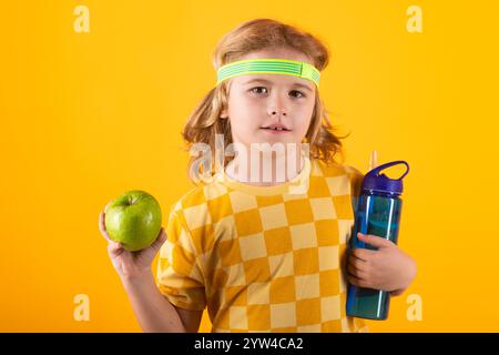 Excited child hold apple on isolated background Stock Photo - Alamy