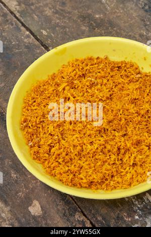 Yellow turmeric powder and dry roots on wooden background Stock Photo ...