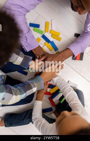 Kids and their dad playing jenga on the floor Stock Photo - Alamy