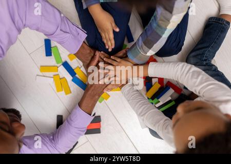 Kids and their dad playing jenga on the floor Stock Photo - Alamy