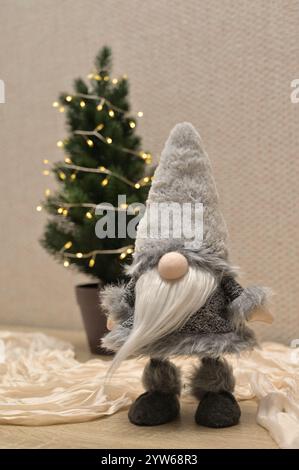 Christmas gnome with decorations on wooden background with space for ...
