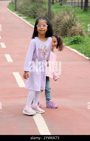 sisterhood. two sisters or friends spending time outdoors on sunny ...