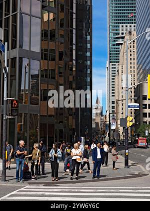 Toronto Canada / Pedestrians walk across the intersection of Bay Street ...