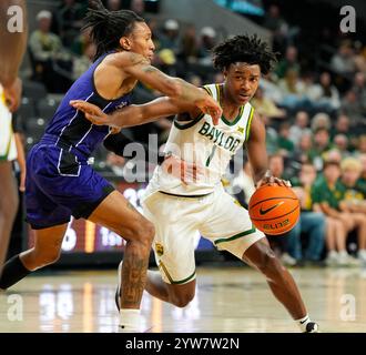 Baylor guard Robert Wright III dribbles the ball upcourt in an NCAA ...