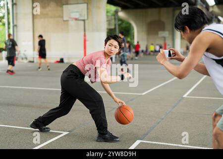 Man recording basketball practice Stock Photo - Alamy