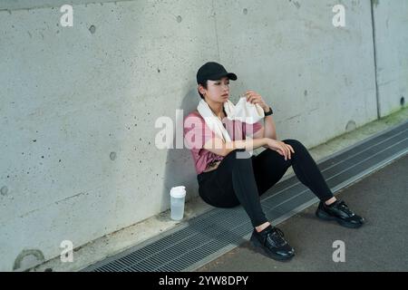 Women who fall ill during exercise Stock Photo - Alamy