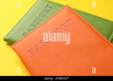 Passports in color covers on light blue background, closeup Stock Photo ...
