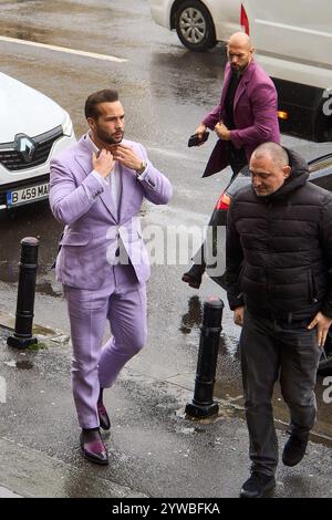 Andrew Tate and his brother Tristan, top left, arrives at a police ...