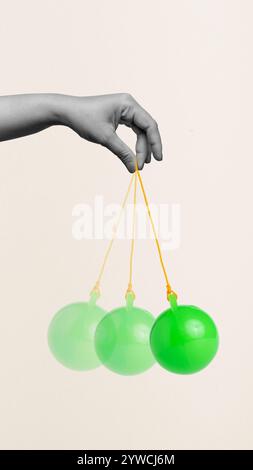 Hand holding a swinging pendulum Stock Photo - Alamy