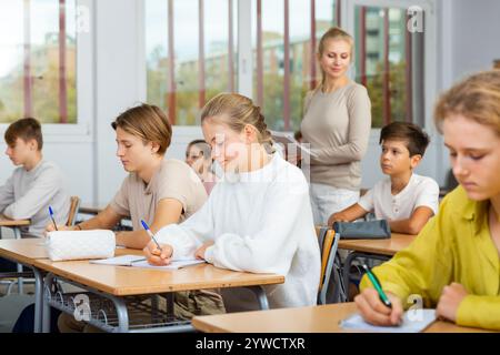Student is sitting test and answer about task in classroom Stock Photo ...