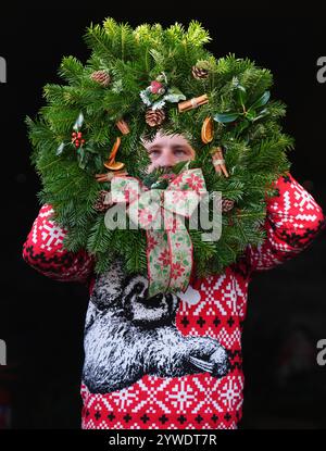 Stephen Roxburgh displays Christmas wreaths after making them at the ...