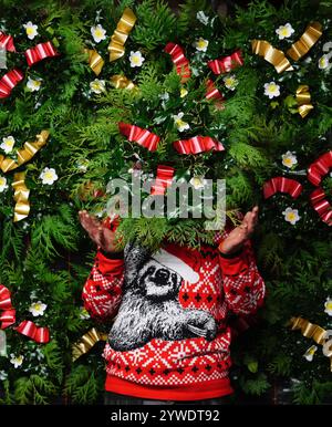 Stephen Roxburgh displays Christmas wreaths after making them at the ...
