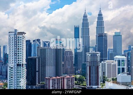 Skyline of Kuala Lumpur with high rise buildings and Petronas Towers ...