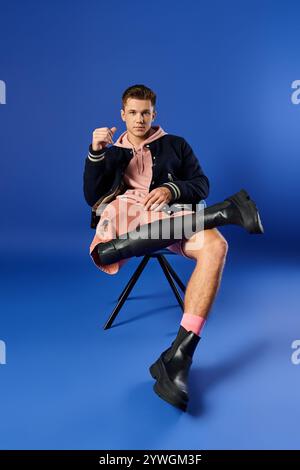 A young man with a prosthetic leg displays fashionable clothing and ...