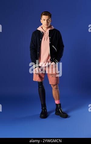 Young man with a prosthetic leg shows style and confidence against a ...