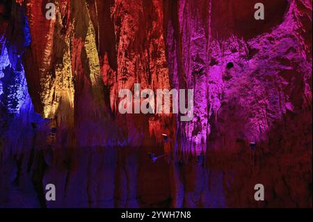 Stalactites illuminated by coloured LED light, stalactite cave ...