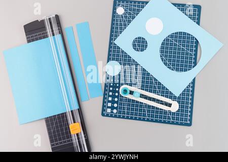 cutting mat with various office supplies and tools, top view, copy ...