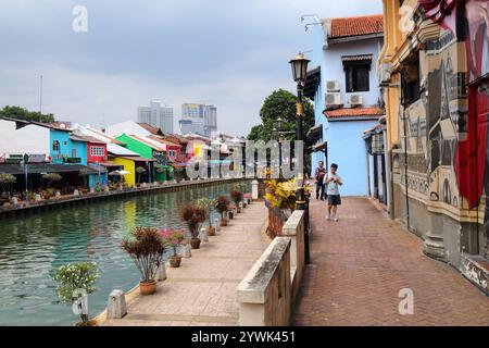 MALACCA, MALAYSIA - MARCH 15, 2024: People visit the River Walk of ...