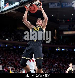 Michigan center Vladislav Goldin dunks during the second half of an ...