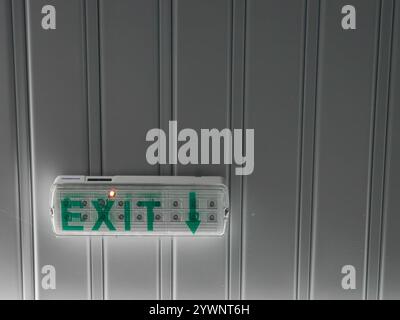 Illuminated Exit Sign: A Path to Escape Stock Photo - Alamy