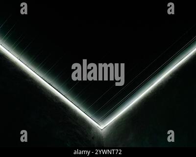 Neon Light Fixture: Angular Illumination Against Black Stock Photo - Alamy