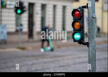 close-up of small traffic semaphore with green light against the ...