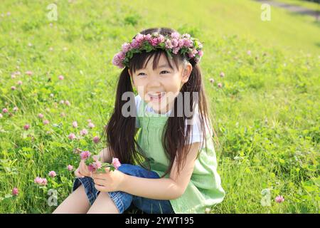 Girl wearing red clover flower crown Stock Photo - Alamy