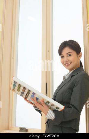 Interior coordinator woman with material samples Stock Photo - Alamy
