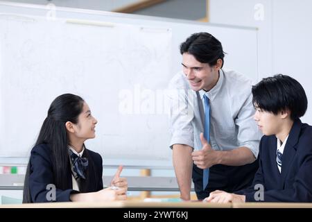 High school student talking with foreign teacher Stock Photo - Alamy