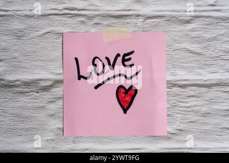 Sticky note with LOVE word handwritten message Stock Photo - Alamy