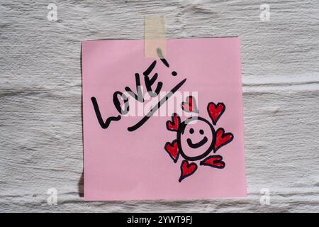 Sticky note with LOVE word handwritten message Stock Photo - Alamy