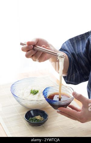 Man eating somen noodles Stock Photo - Alamy
