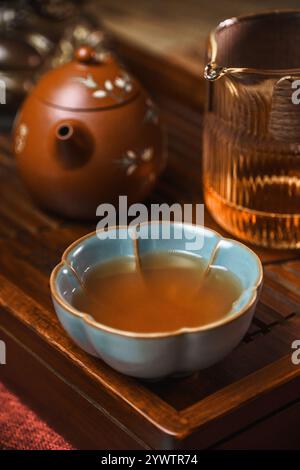 A beautifully crafted ceramic pot features intricate floral and lotus ...