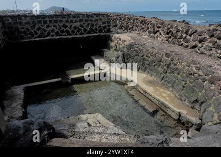 Traditional bathing pool along the Jeju Olle Trail in rural Jeju Island ...