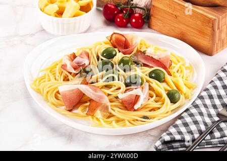 Delicous Pasta spaghetti with olives and jamon Stock Photo - Alamy
