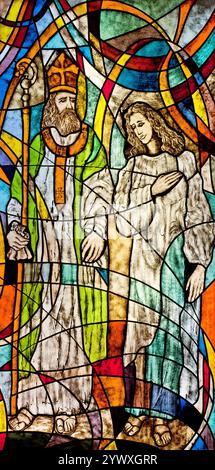 Stained glass showing the bishop and his church in the background Stock ...