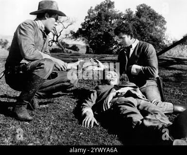 Dee Pollock, Richard Rust, Michael Landon, on-set of the western film ...
