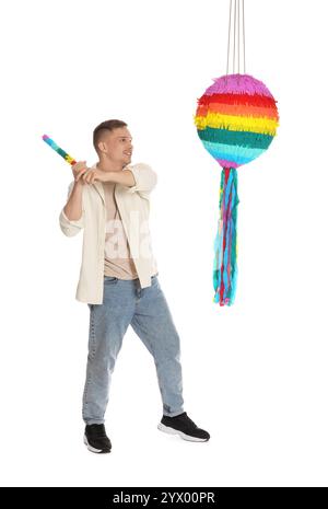 Happy man breaking pinata on white background Stock Photo - Alamy