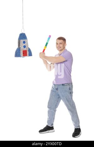 Happy man breaking pinata on white background Stock Photo - Alamy