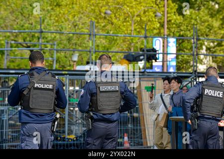 French Police officers patrol the area around the Arc de Triumphe in ...